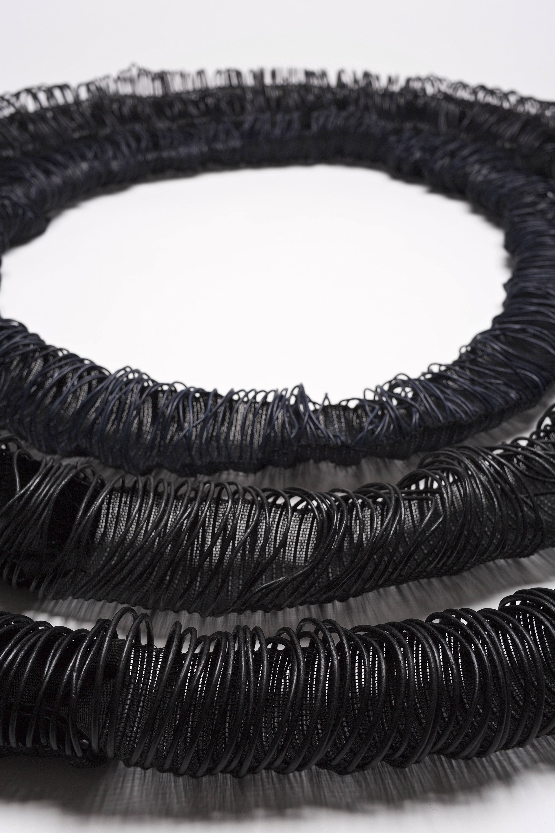 'Containment' detail of the installation. Handwoven with leather lacing ...